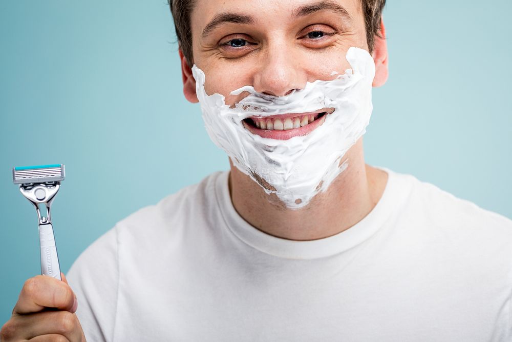 Man shaving cream face, holding | Free Photo - rawpixel