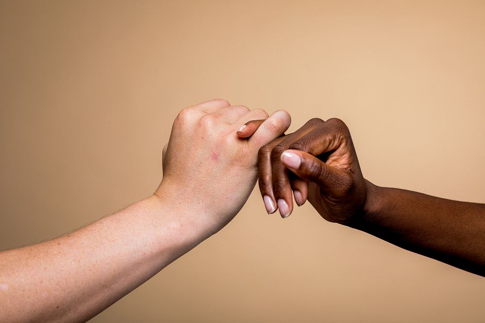 Two hands, one light-skinned and | Free Photo - rawpixel