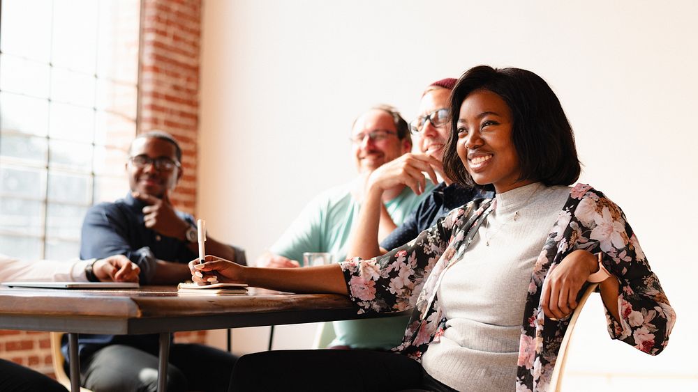 Diverse group meeting. Smiling woman, | Free Photo - rawpixel