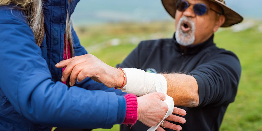 person bandages an injured arm | Free Photo - rawpixel