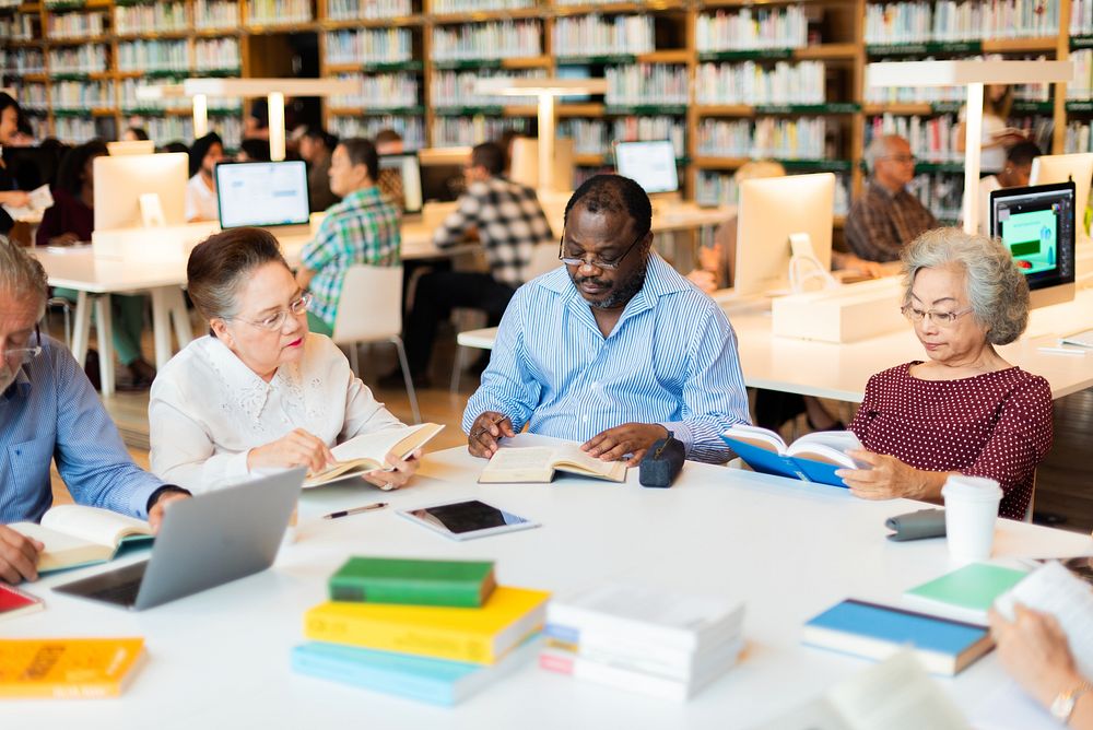 Diverse group reading library. Men | Free Photo - rawpixel