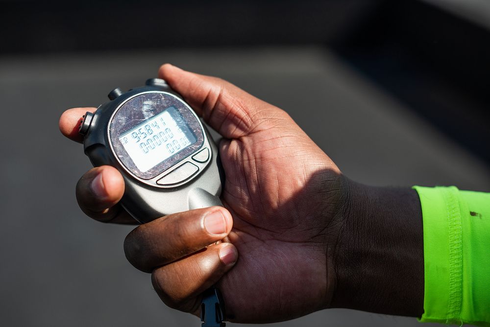 Close-up hand holding stopwatch, displaying | Free Photo - rawpixel