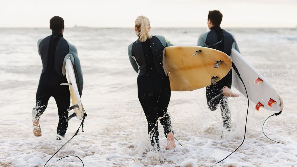 Three surfers surfboards run ocean. | Free Photo - rawpixel