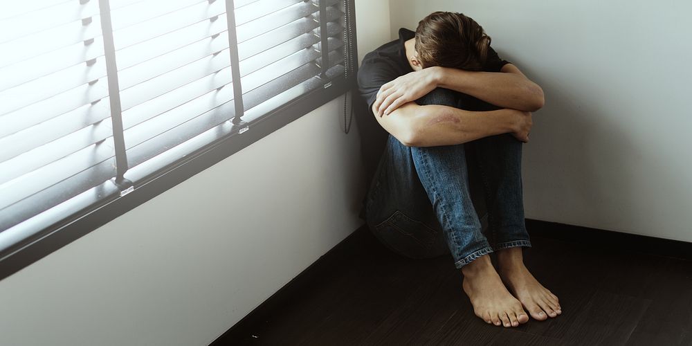 Person sitting floor, hugging knees | Free Photo - rawpixel