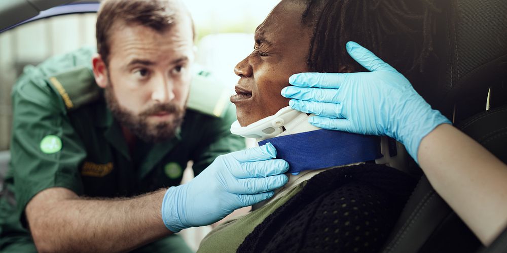 Paramedic assists injured person neck | Free Photo - rawpixel