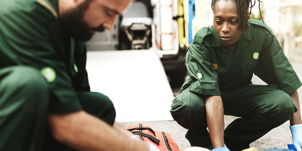 Two paramedics green uniforms assist | Free Photo - rawpixel