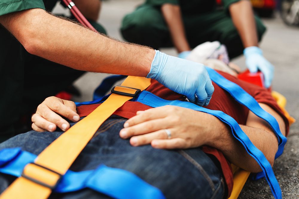 Emergency responders assist an injured | Free Photo - rawpixel