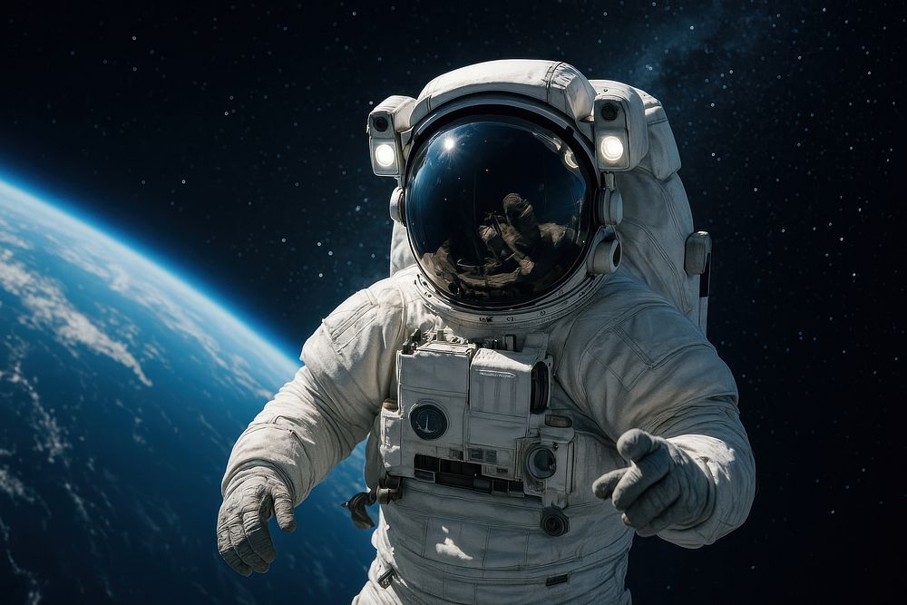 Astronaut floating above Earth | Free Photo - rawpixel