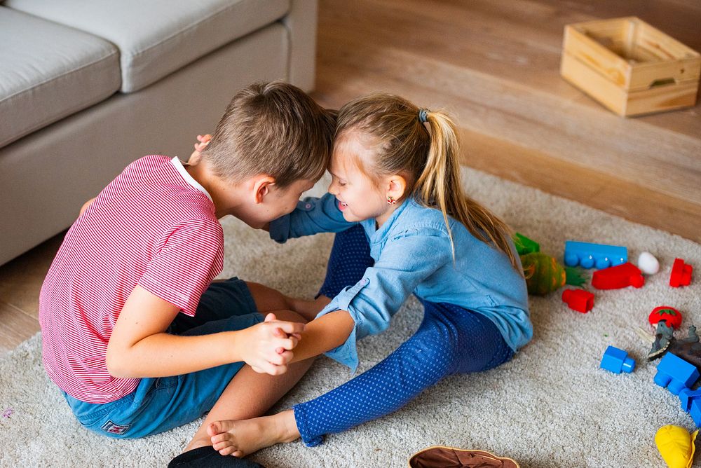 Two children playing carpet toys, | Free Photo - rawpixel