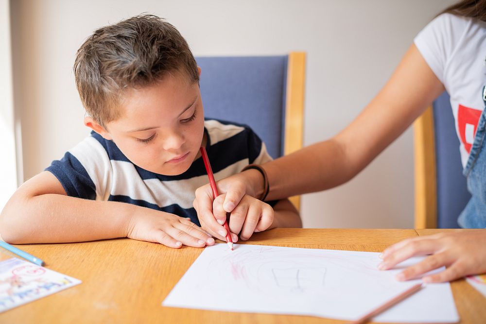 Child drawing assistance table. Focused | Free Photo - rawpixel