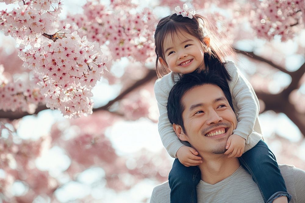 father carries his daughter blossom | Free Photo - rawpixel