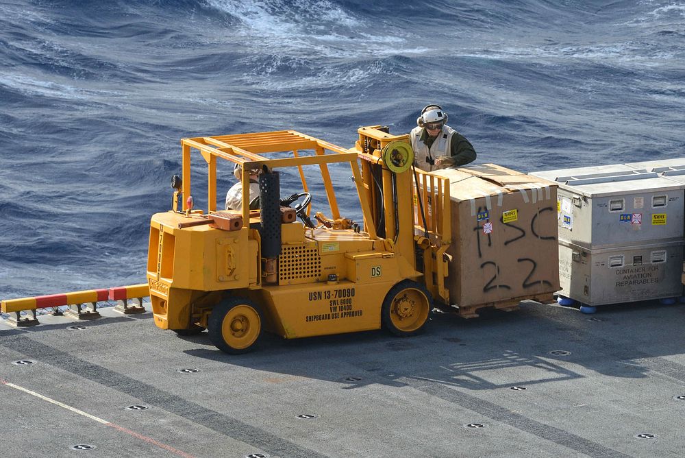 U.S. Sailors move pallets supplies | Free Photo - rawpixel