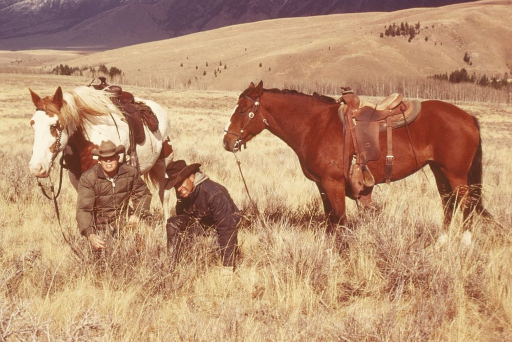 Historical photo cowboys resting their | Free Photo - rawpixel