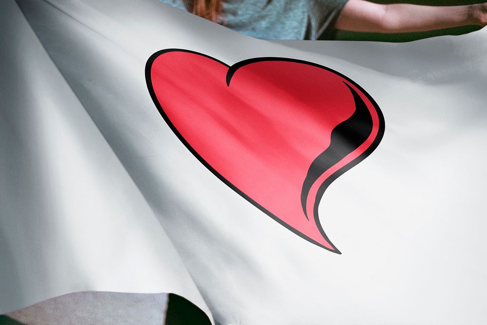 Person holding heart sticker flag, | Free Photo - rawpixel
