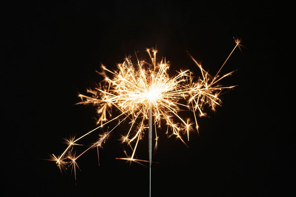 Burning sparkler on a black | Free Photo - rawpixel