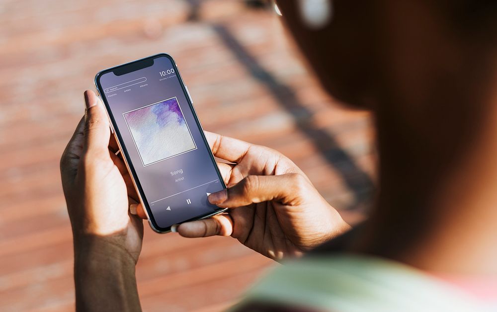 Woman using phone, listening music | Free Photo - rawpixel