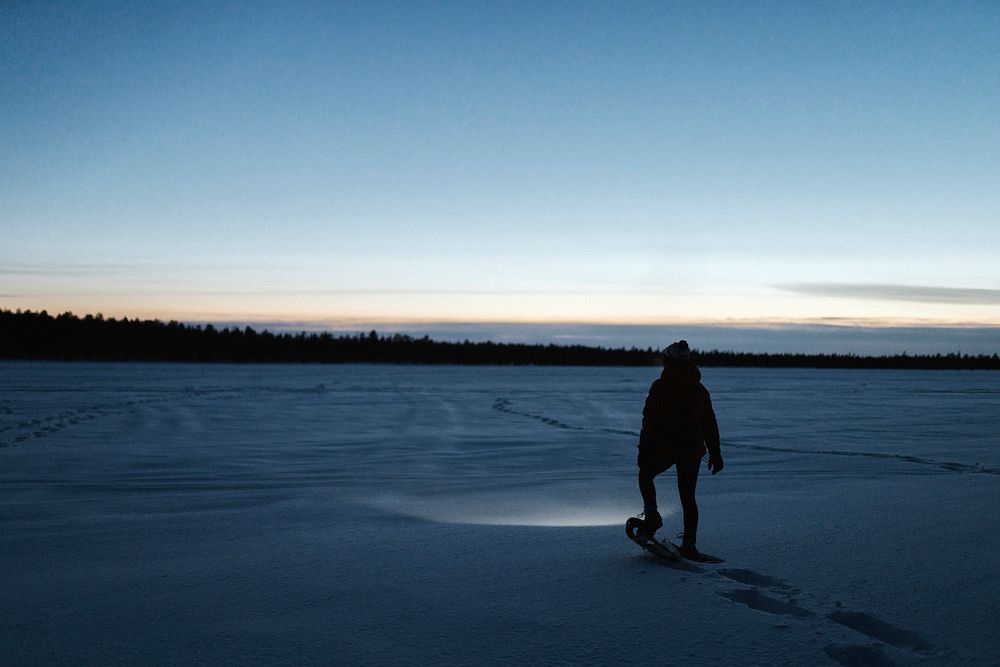 Woman wearing headlights and snowshoeing | Premium Photo - rawpixel