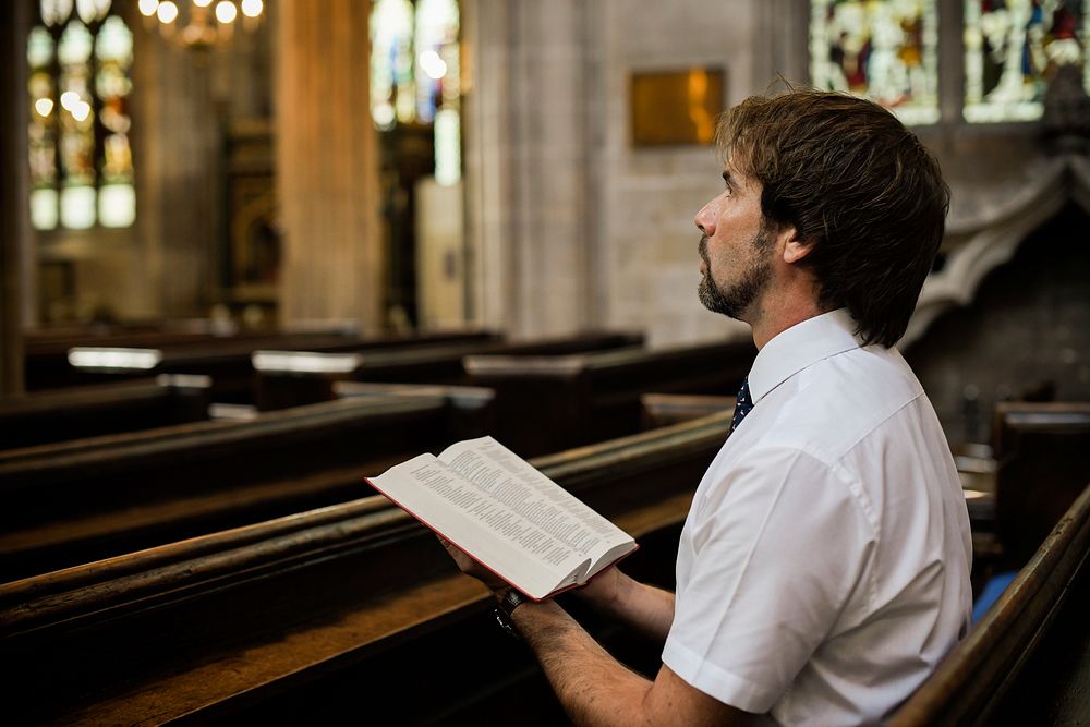 Man praying alone at church | Premium Photo - rawpixel