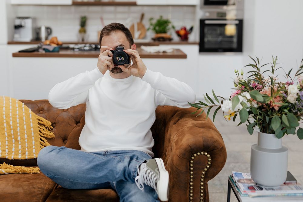 Photographer sitting couch working | Premium Photo - rawpixel