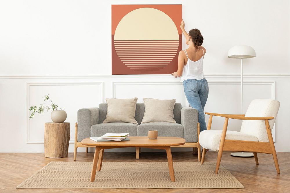 Woman hanging picture frame, Scandinavian | Free Photo - rawpixel