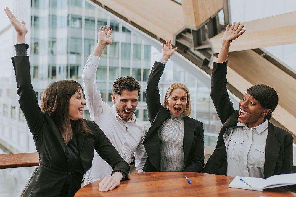 Business colleagues raising hands, teamwork | Premium Photo - rawpixel