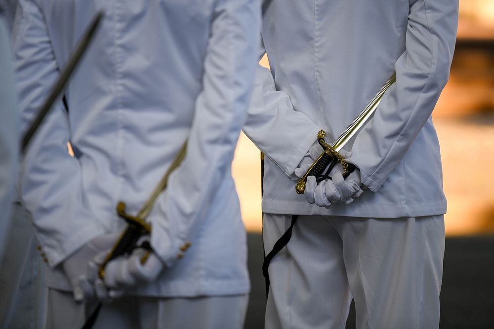 participant holds their ceremonial sword | Free Photo - rawpixel