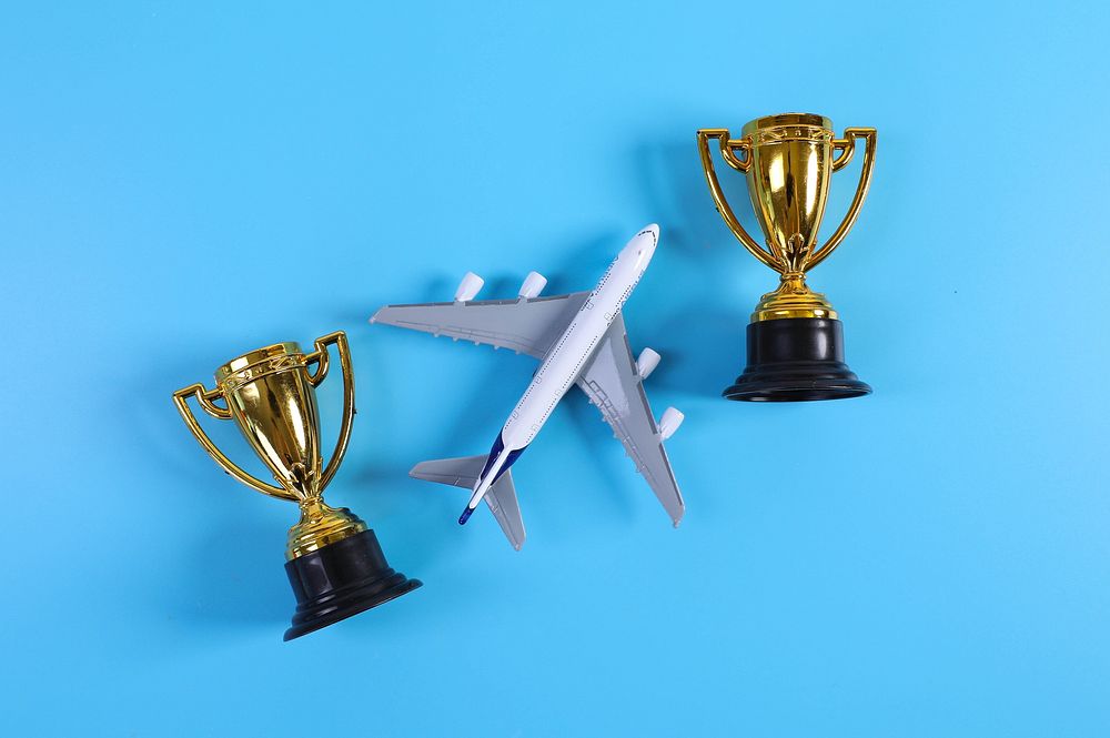 Miniature airplane golden trophies | Free Photo - rawpixel
