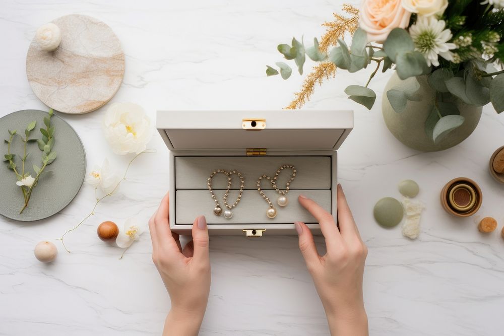 Jewelry box table hand. AI | Premium Photo - rawpixel