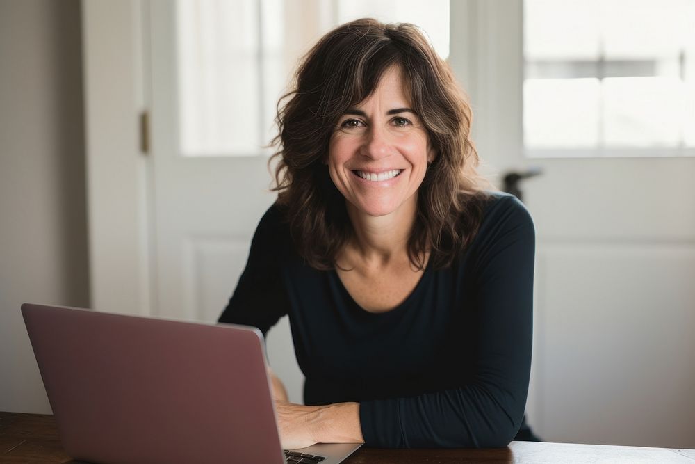 Middle-age woman laptop computer smiling. | Free Photo - rawpixel