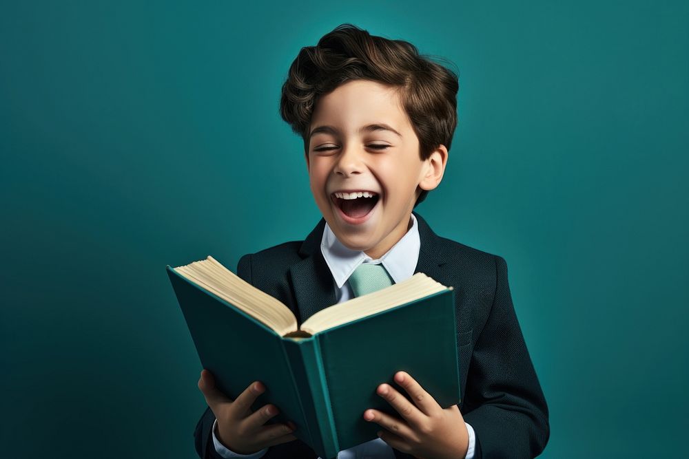 School boy laughing book publication. | Free Photo - rawpixel