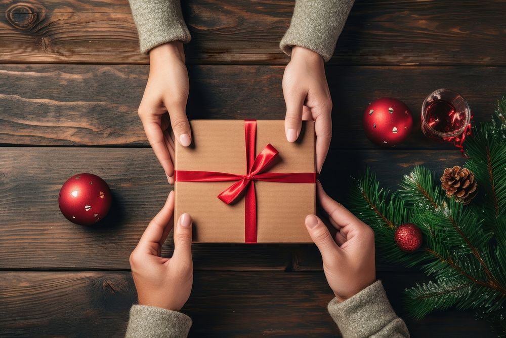 Hands exchanging gift box christmas | Free Photo - rawpixel