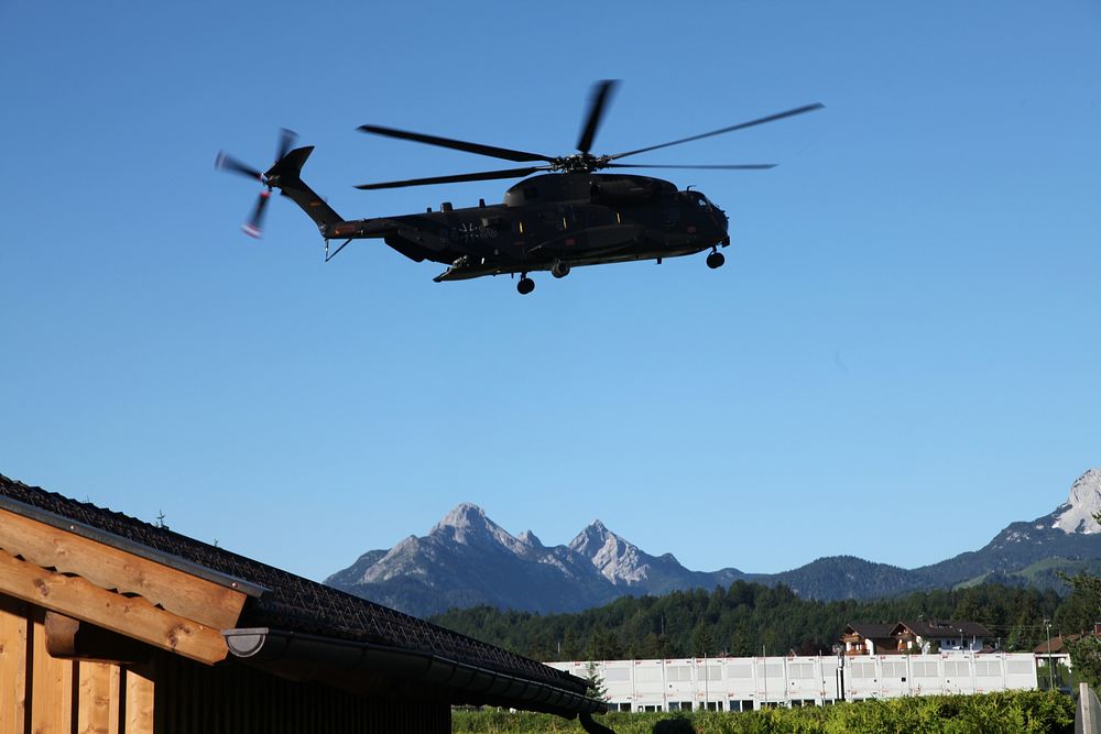 Helicopter over mountain landscape | Free Photo - rawpixel