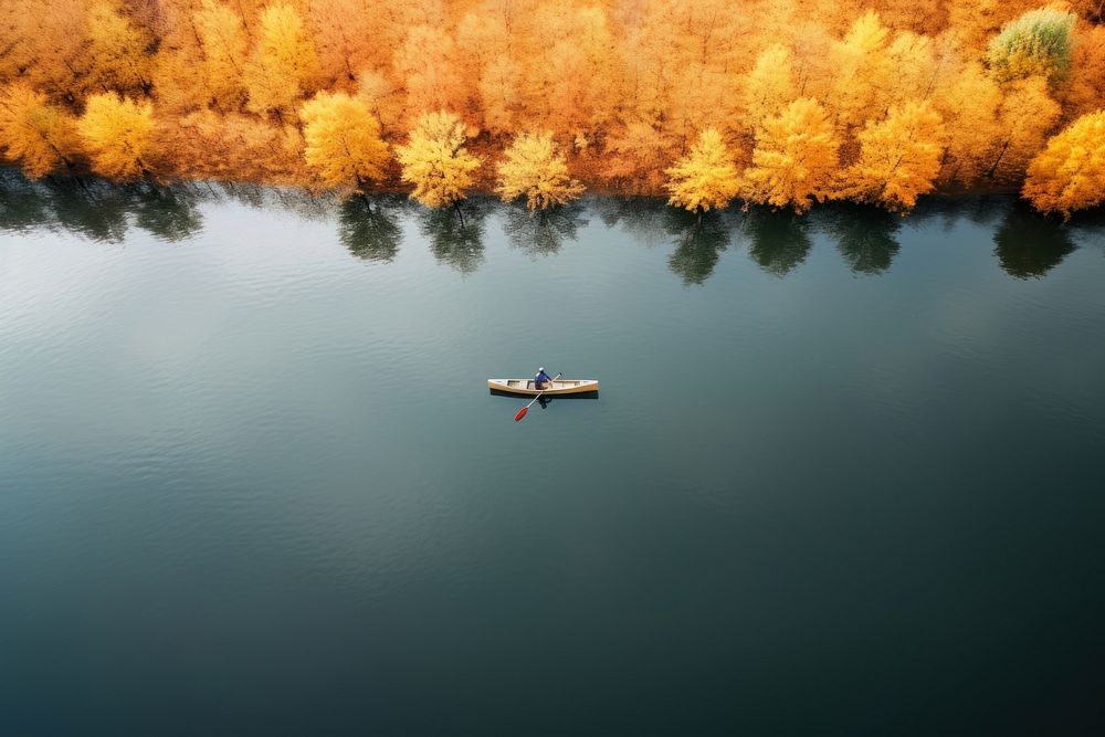 Rowing autumn lake boat. AI | Free Photo - rawpixel