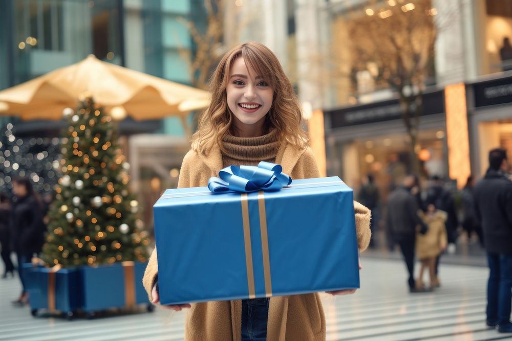 Woman carrying large present box, | Free Photo - rawpixel