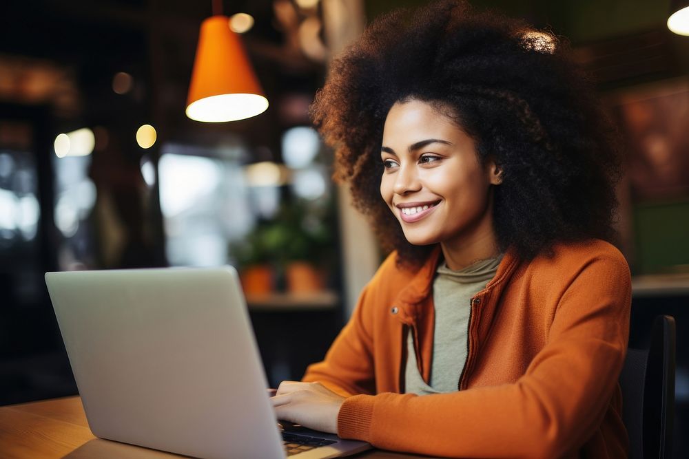 Black woman using laptop smiling | Free Photo - rawpixel