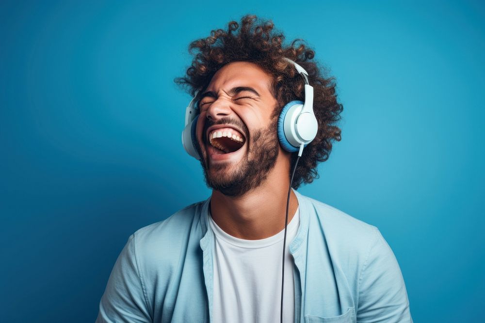 Man wearing headphones laughing headset | Free Photo - rawpixel