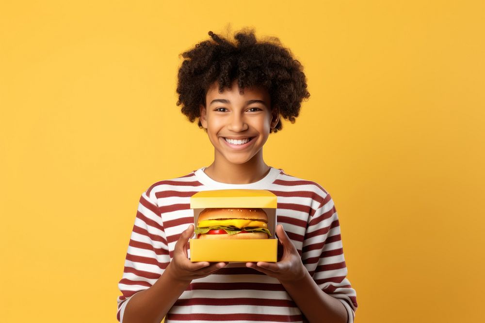 Teenage boy holding burger box. | Free Photo - rawpixel