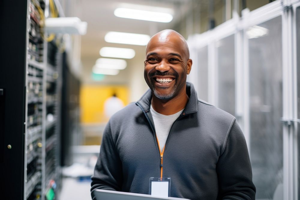Smiling technician laptop server room | Premium Photo - rawpixel