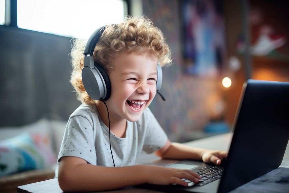 Kid headphones computer laptop. AI | Free Photo - rawpixel