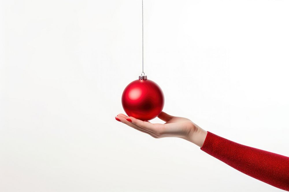 Christmas holding hand red. AI | Free Photo - rawpixel