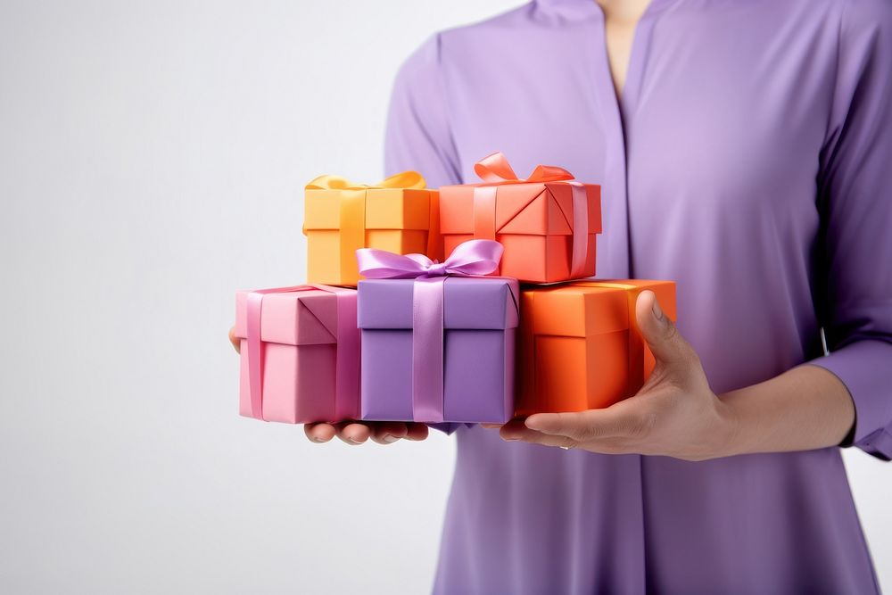 hand carrying festive gift boxes | Premium Photo - rawpixel