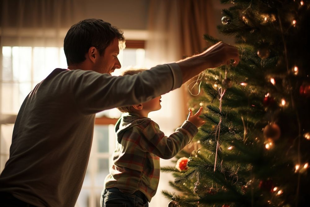 Father chrimas tree decorating todler. | Free Photo - rawpixel