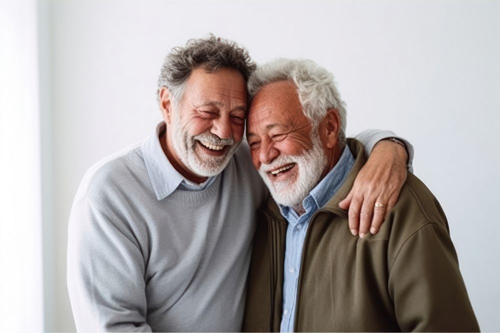 Two elderly men hugging laughing | Free Photo - rawpixel