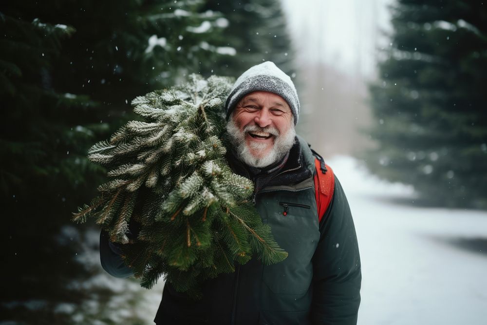 Middle age man carrying christmas | Free Photo - rawpixel