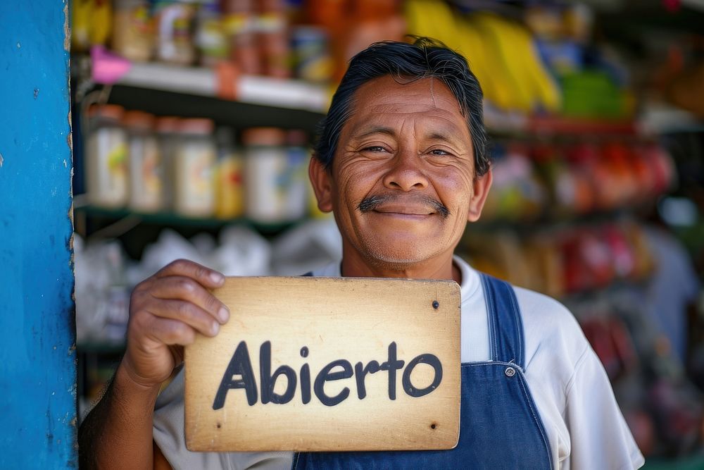 Mexican business owner holding adult | Premium Photo - rawpixel