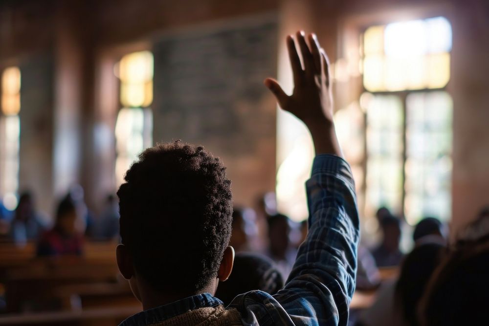 Back view student raising his | Free Photo - rawpixel