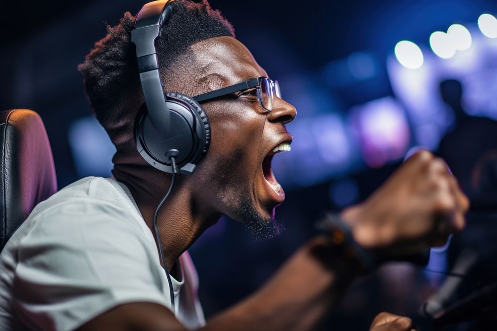 Black male wearing headphone gaming | Free Photo - rawpixel