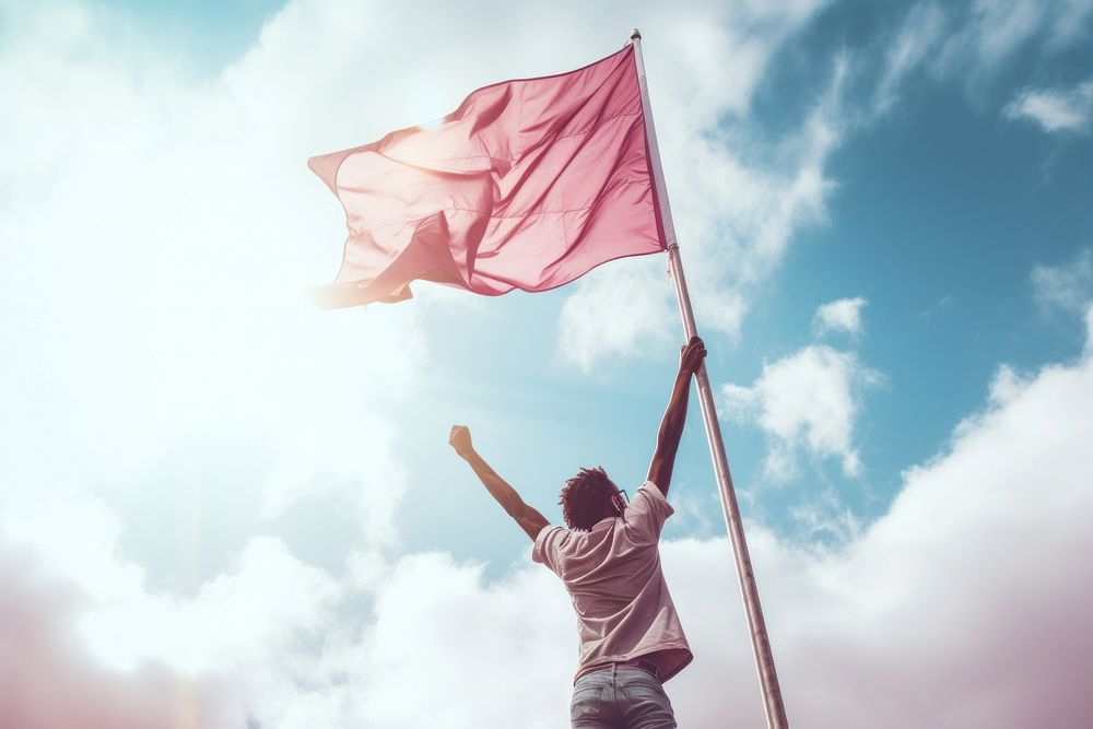 person raising flag sky success | Premium Photo - rawpixel