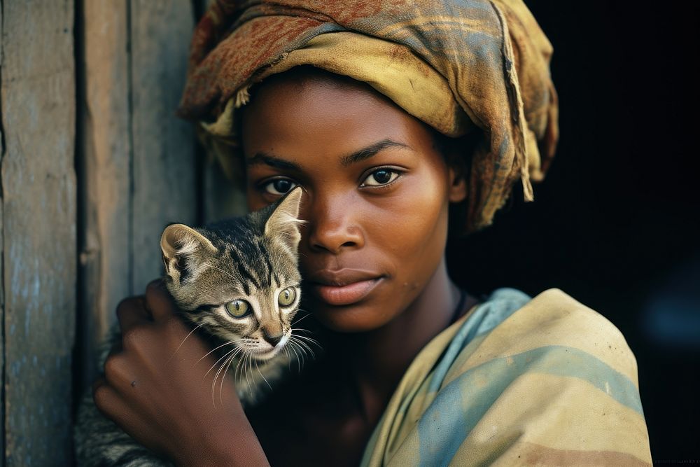 An african woman carry cat | Premium Photo - rawpixel
