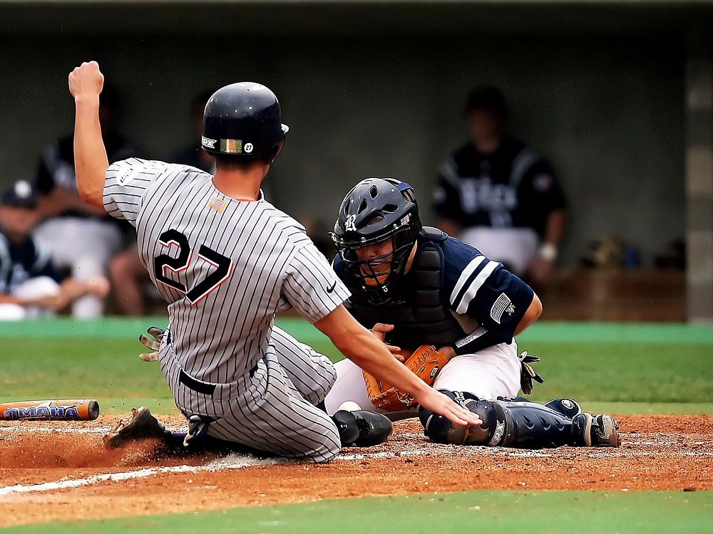 Baseball player sliding into home | Free Photo - rawpixel